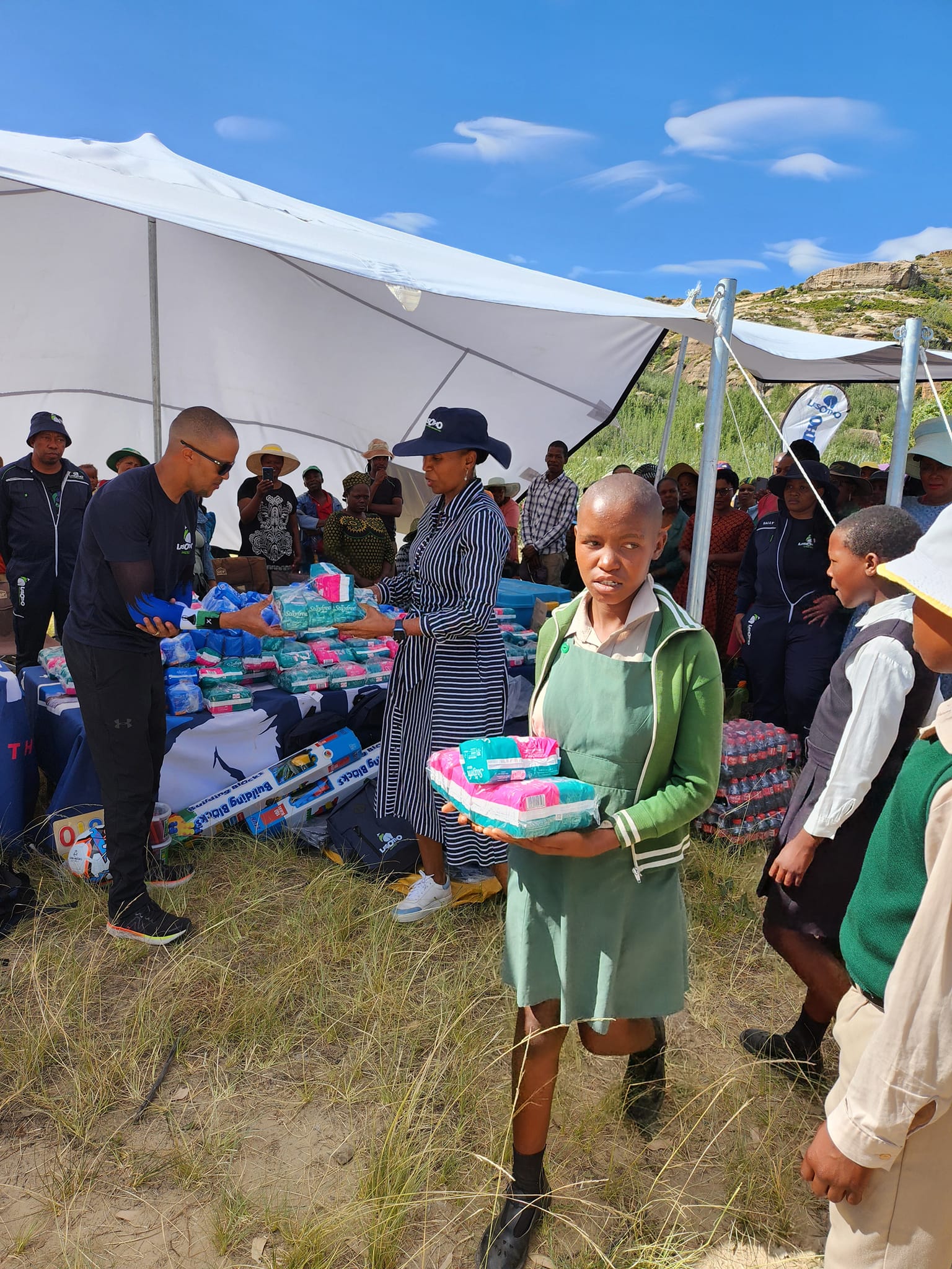 HER MAJESTY PRESENTS SANITARY PADS, SCHOOL BAGS - Government of Lesotho