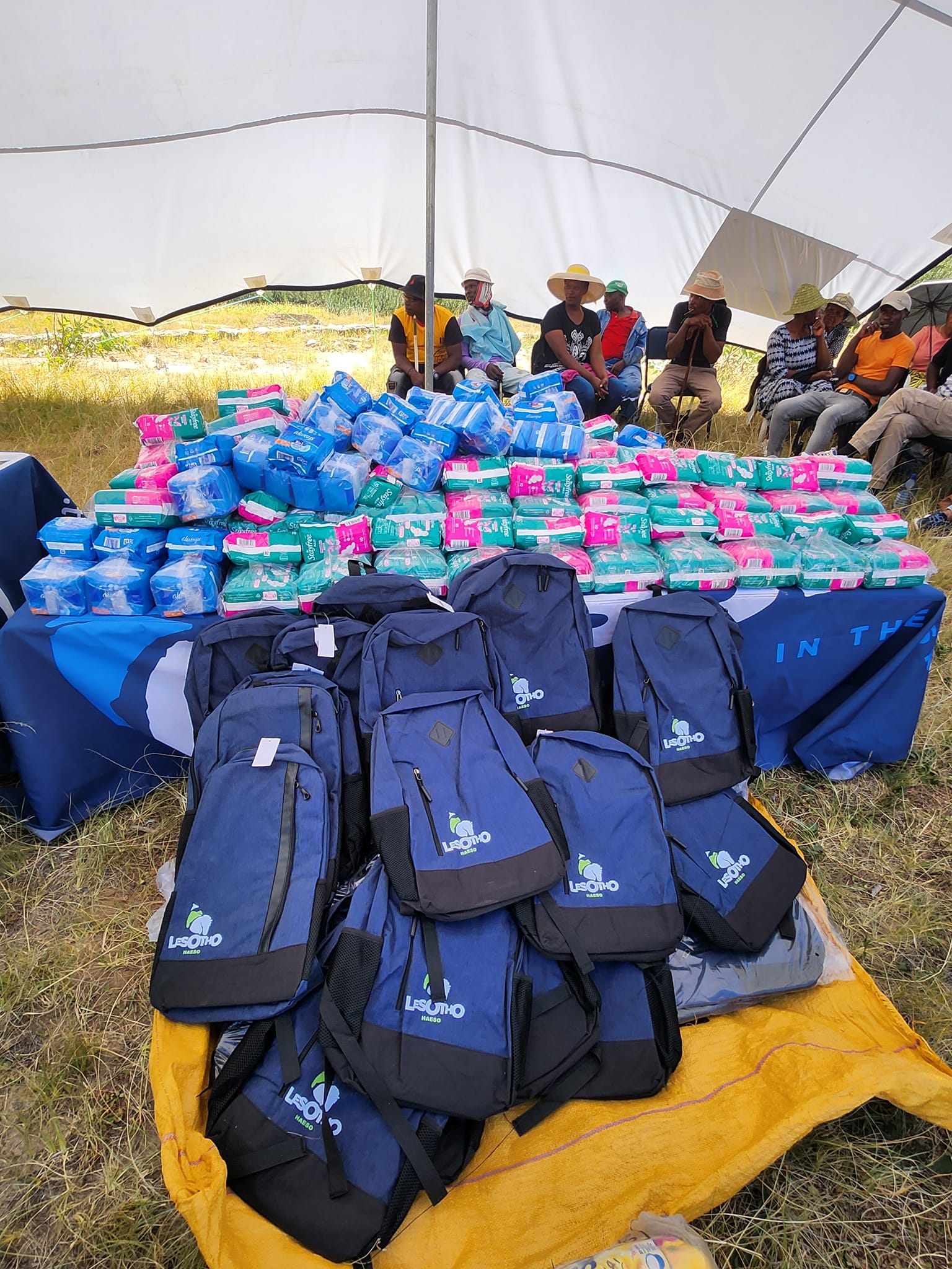 HER MAJESTY PRESENTS SANITARY PADS, SCHOOL BAGS - Government of Lesotho